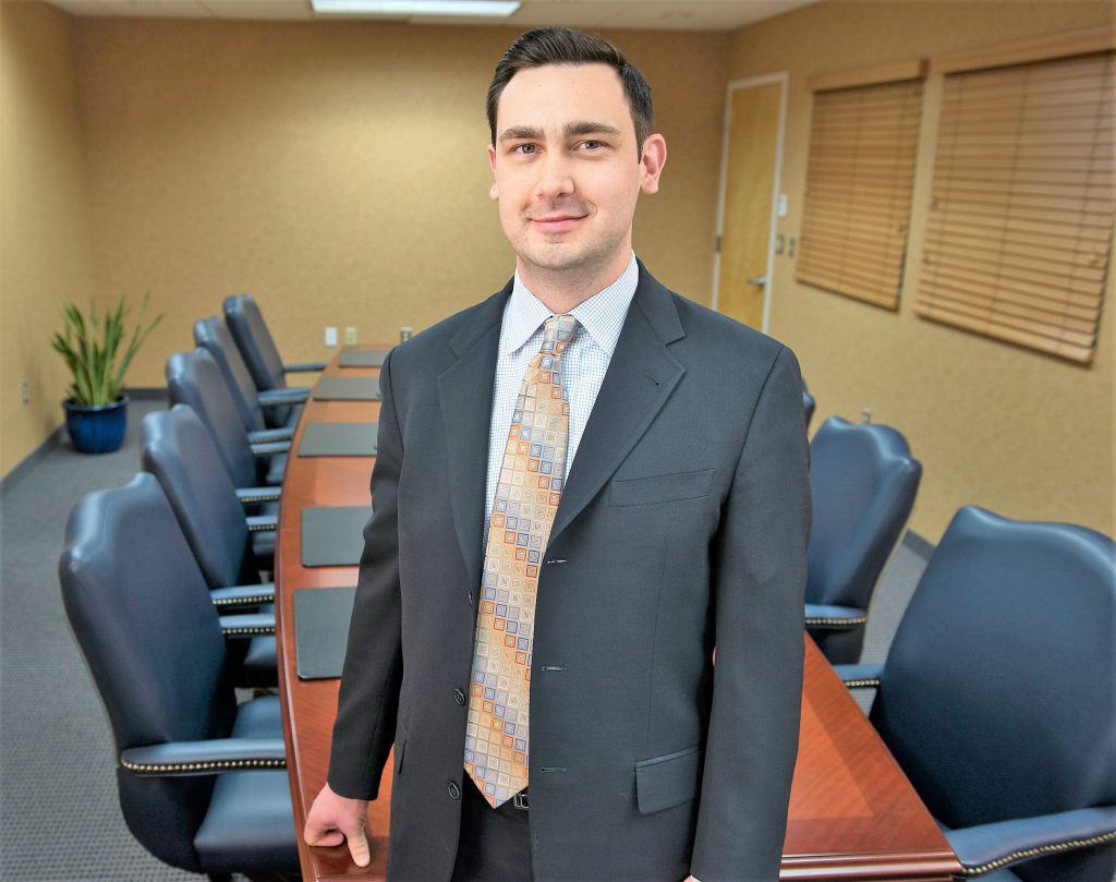 Eric J. Einhart becomes Partner - Russo Law Group